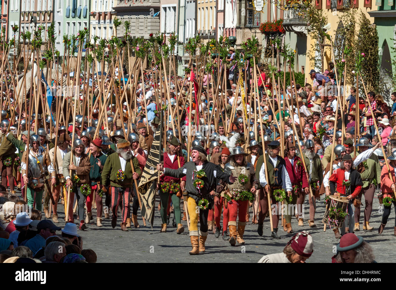 Mercenaries with lances, wedding procession in medieval costumes to ...