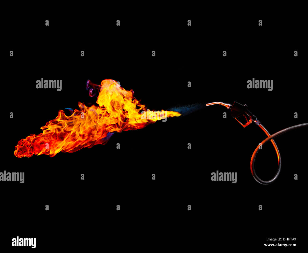 Gas pump handle in flames Stock Photo - Alamy