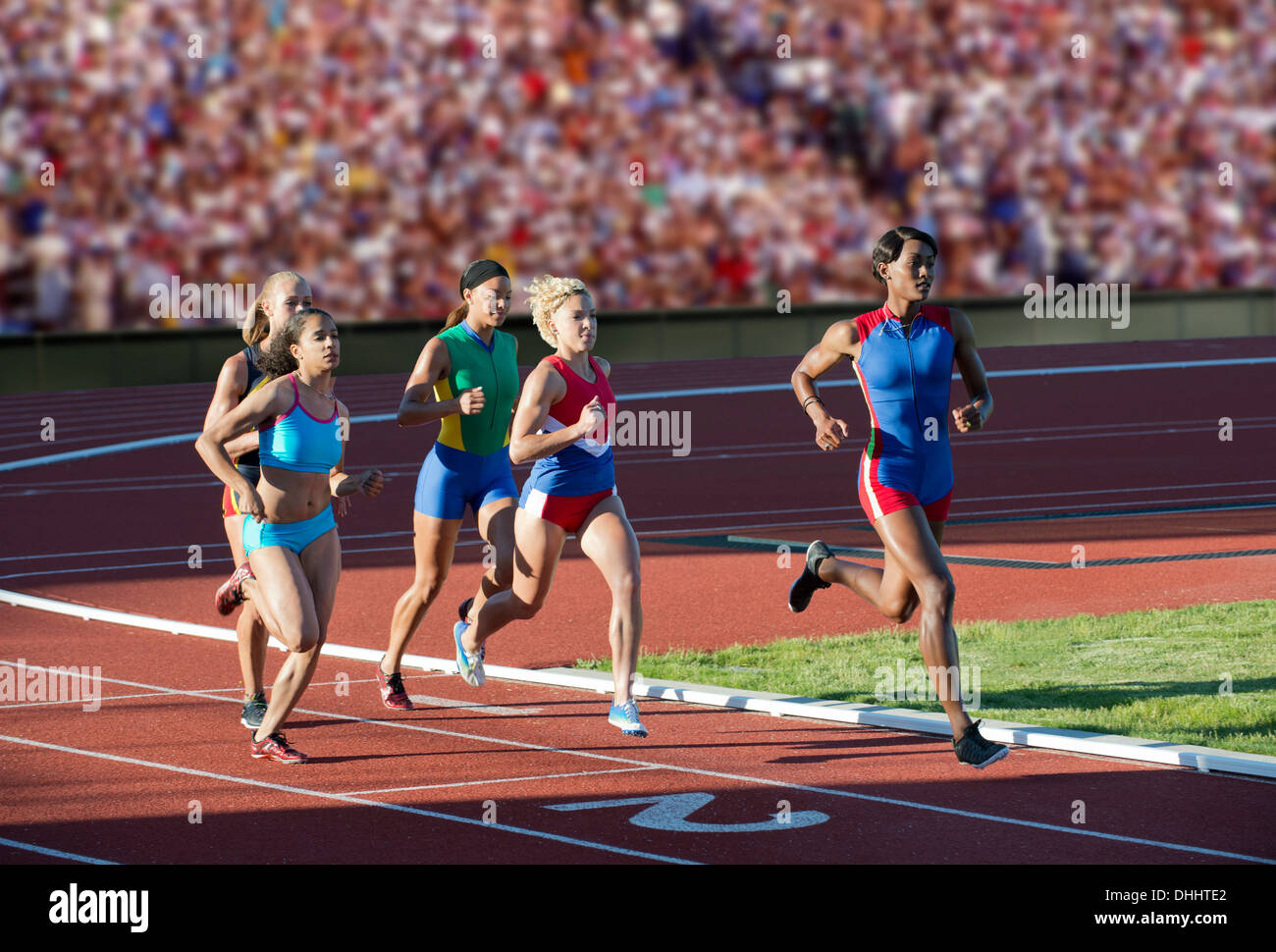 Runners racing on track Stock Photo - Alamy