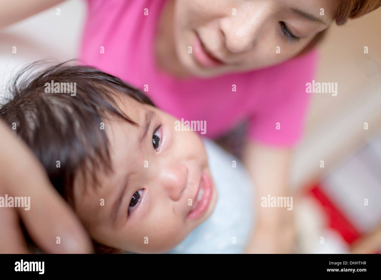 Mother pacifying crying baby Stock Photo - Alamy