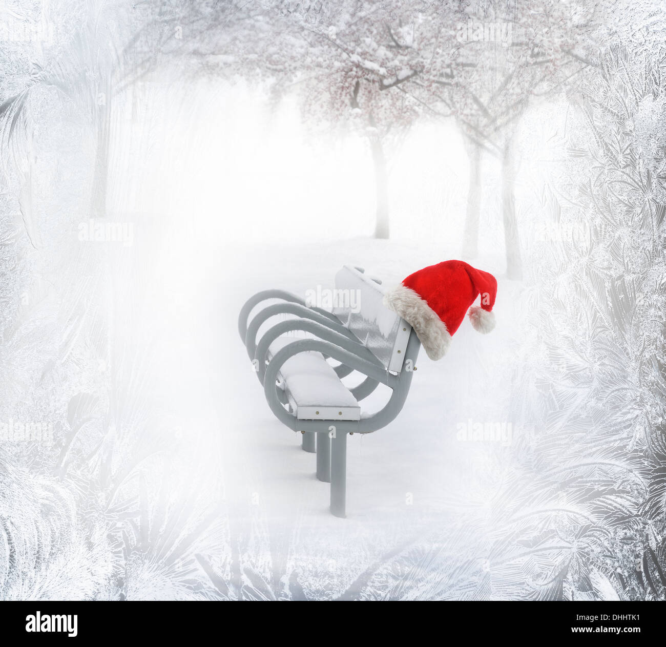 Santa Claus Red On A Bench In A Winter Park Stock Photo - Alamy