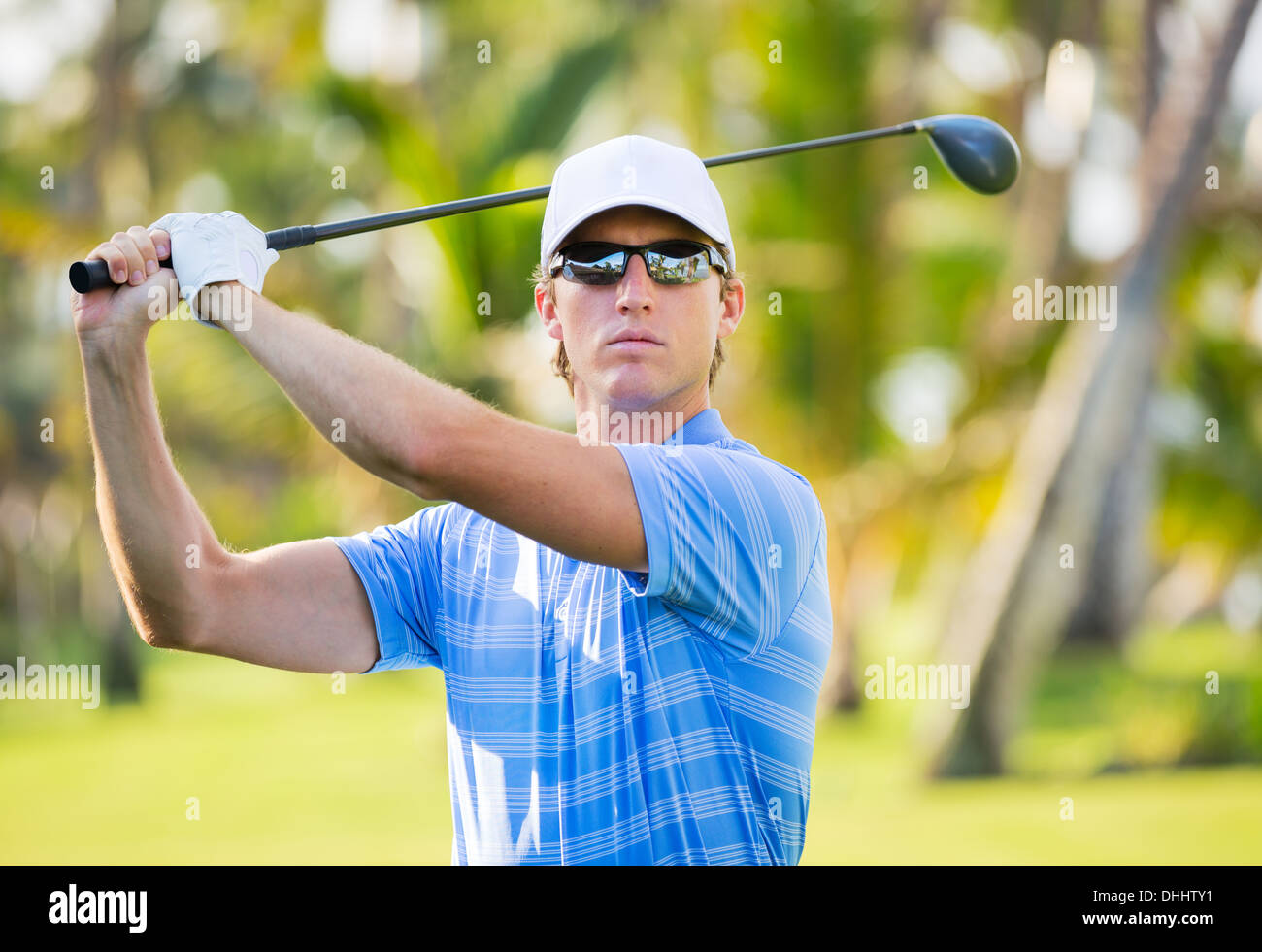 Golf player action swinging ball hi-res stock photography and images ...