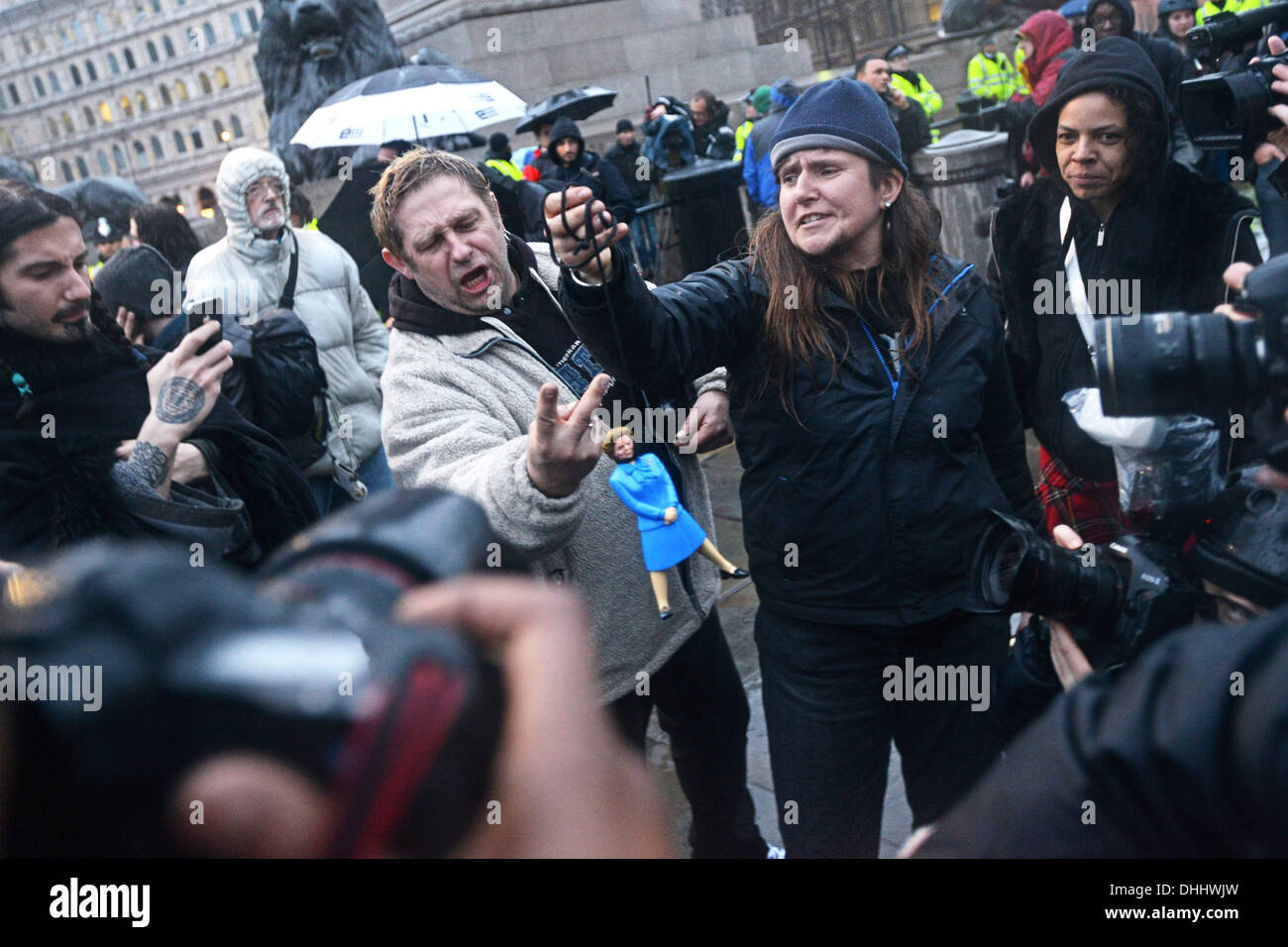 Margaret Thatcher Demonstration Trafalgar Square. A man holds a hanging ...
