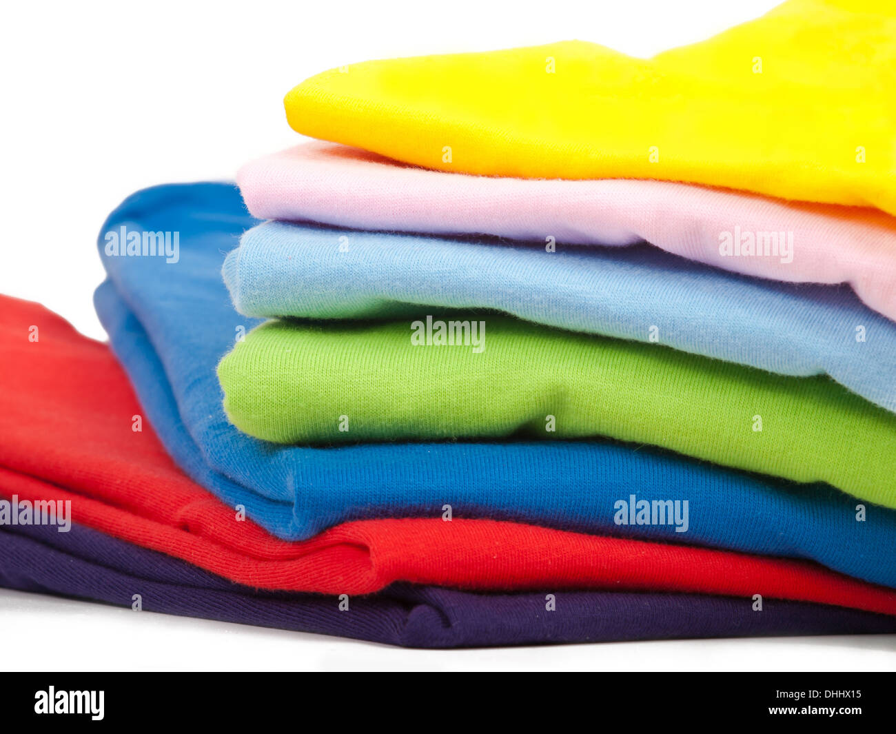 seven colorful t-shirts isolated on white background Stock Photo - Alamy