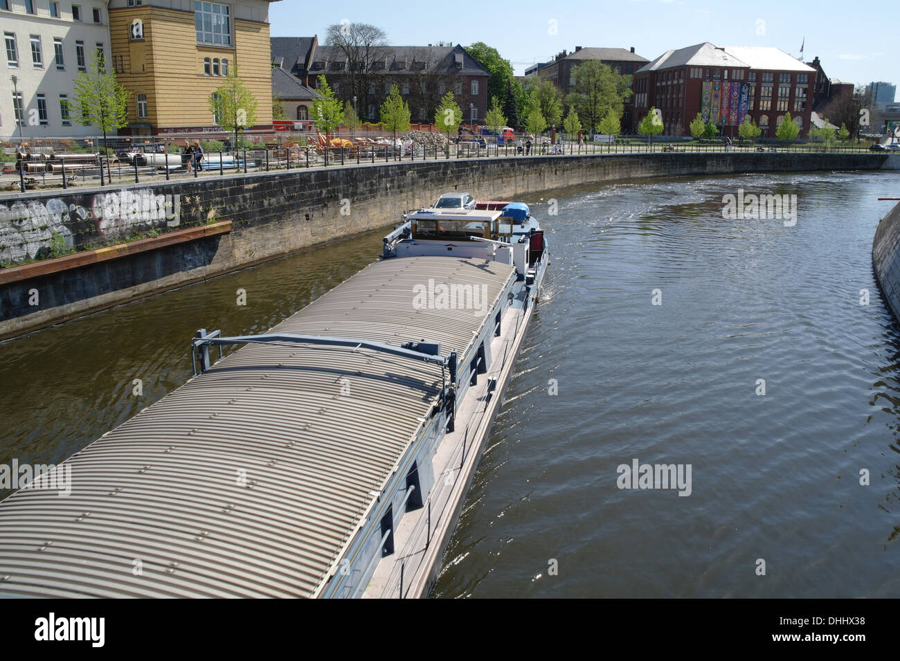 Blue sky view long covered decks cargo barge moving north towards ...