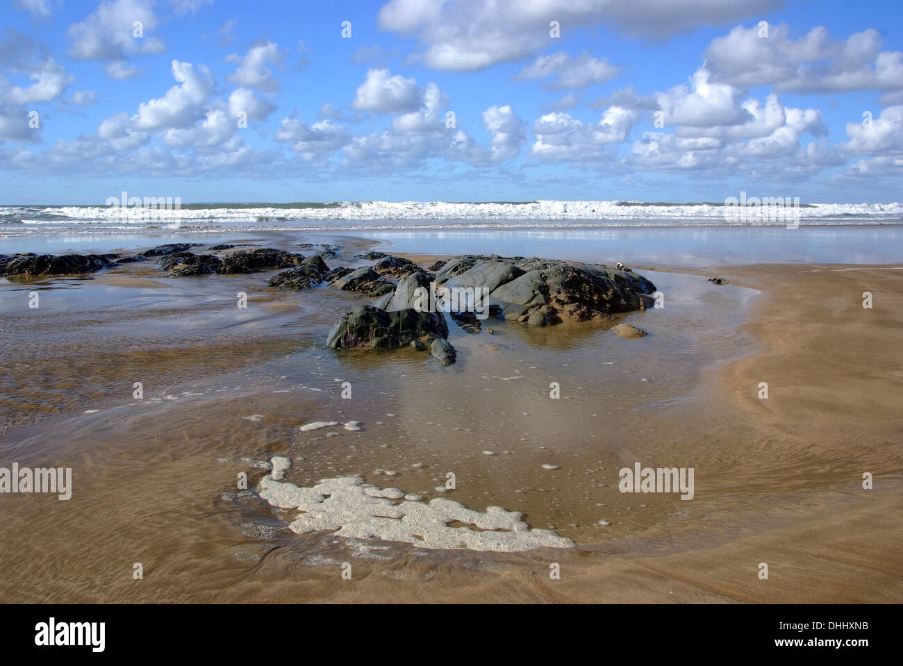 wide view open beach sea & rocks Stock Photo - Alamy