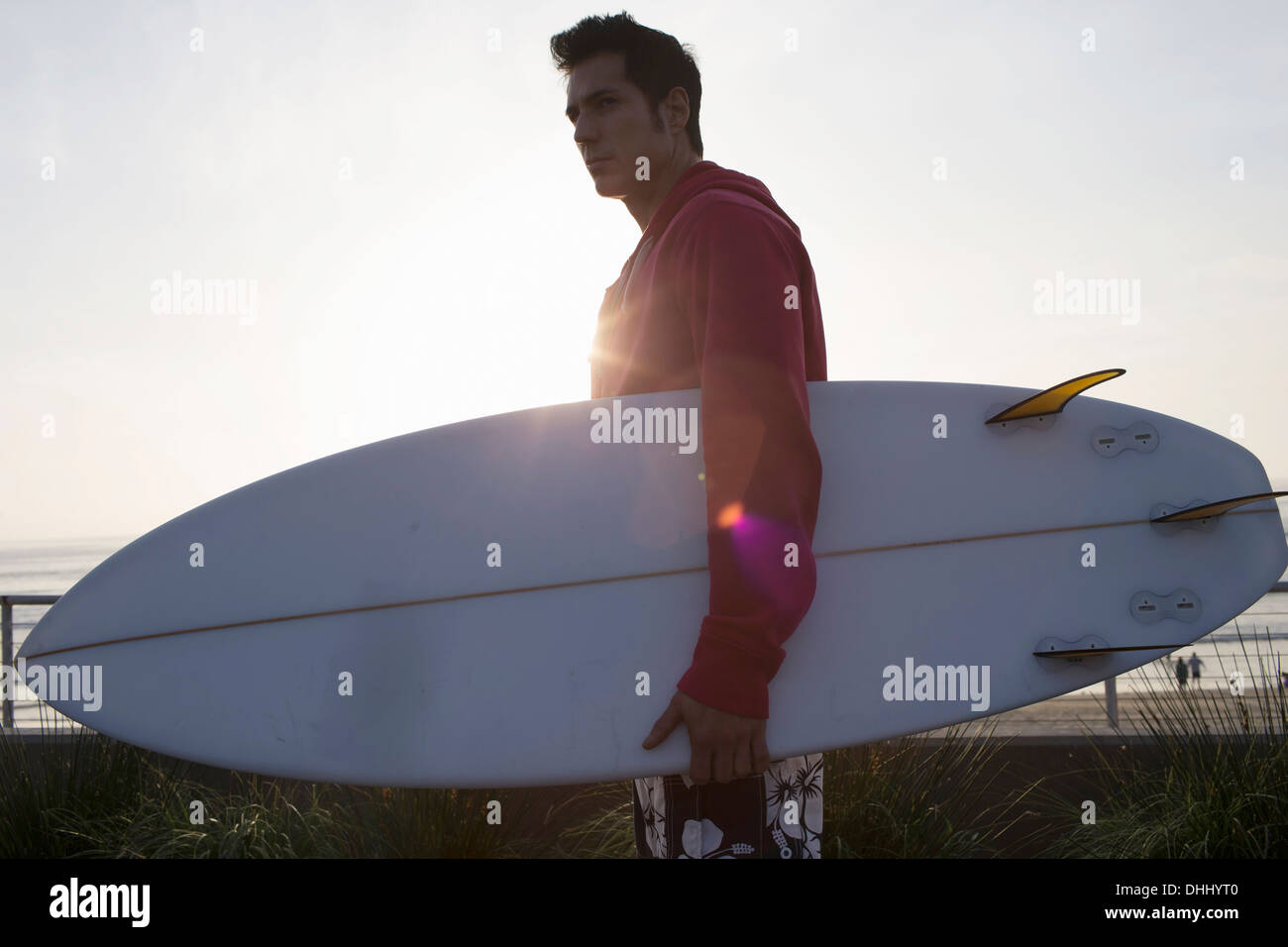 Man carrying surfboard hi-res stock photography and images - Alamy