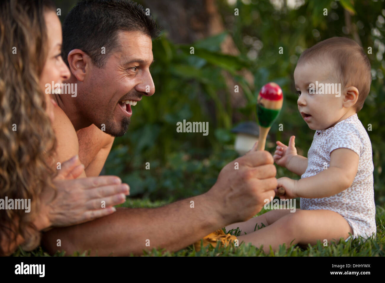 Baby girl with rattle hi-res stock photography and images - Alamy
