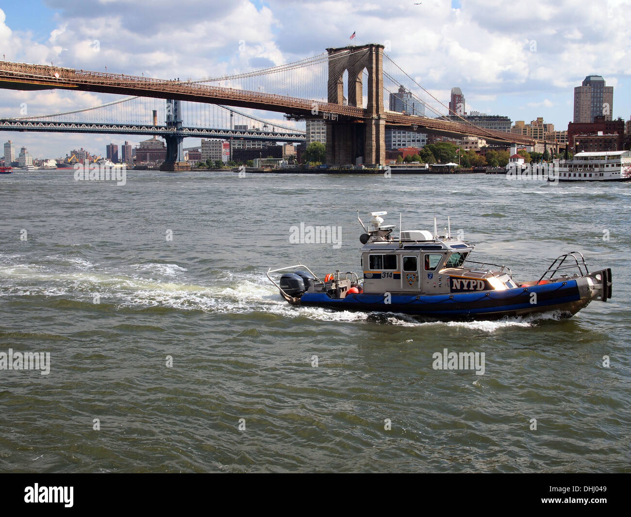 NYPD New York Police Department patrol boat passes under the Brooklyn ...