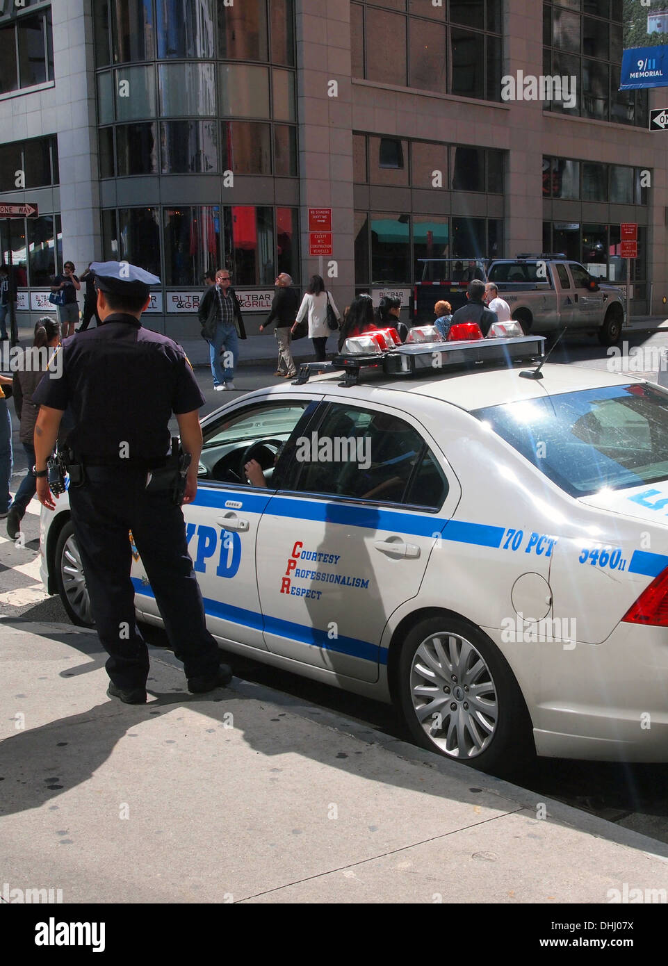 NYPD New York Police Department officer and car in Manhattan, New York ...