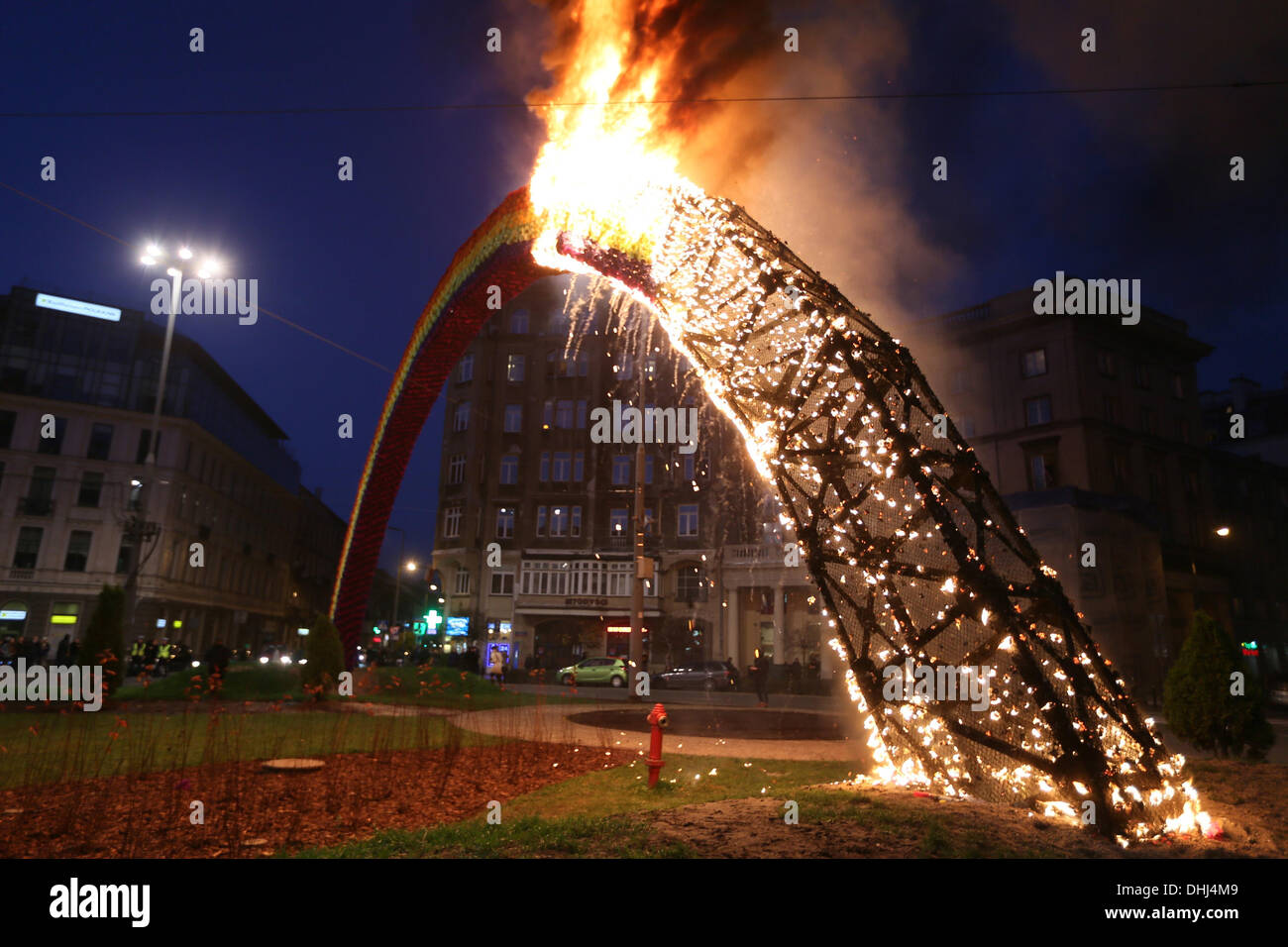 Warsaw, Poland. 11th Nov, 2013. A 'Rainbow' installation is set on fire ...