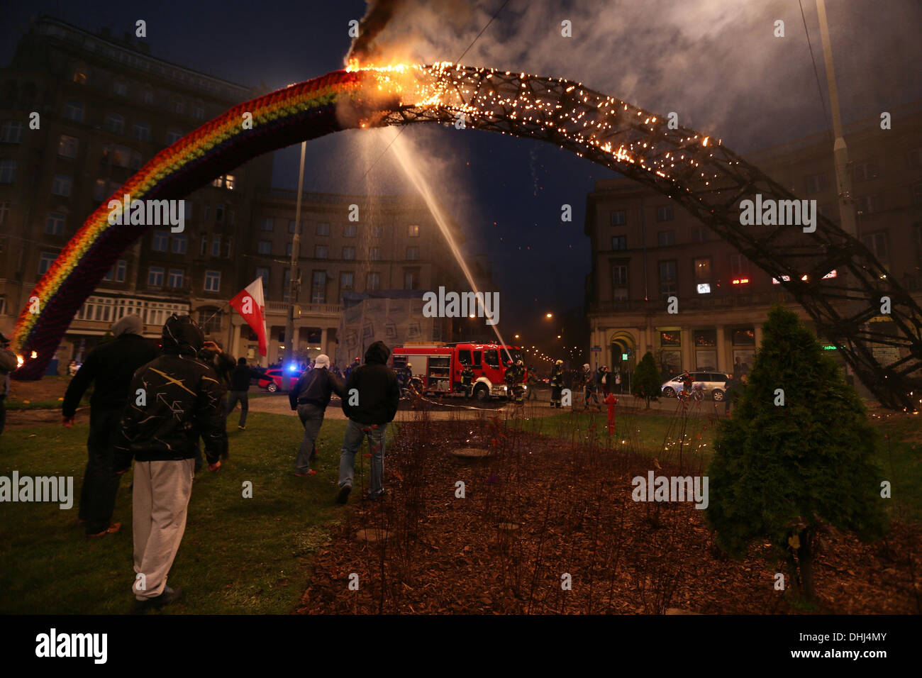 Warsaw, Poland. 11th Nov, 2013. A 'Rainbow' installation is set on fire ...
