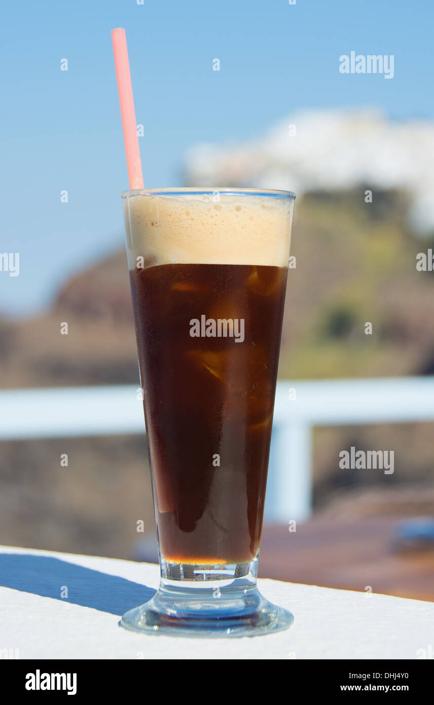 A glass of cold, frothy 'espresso fredo' iced black coffee Stock Photo ...
