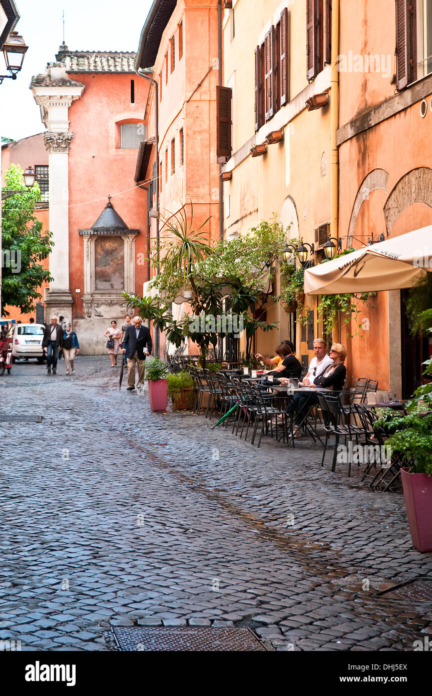 Cafe in a cobbled street in Trastevere, Rome, Italy Stock Photo - Alamy
