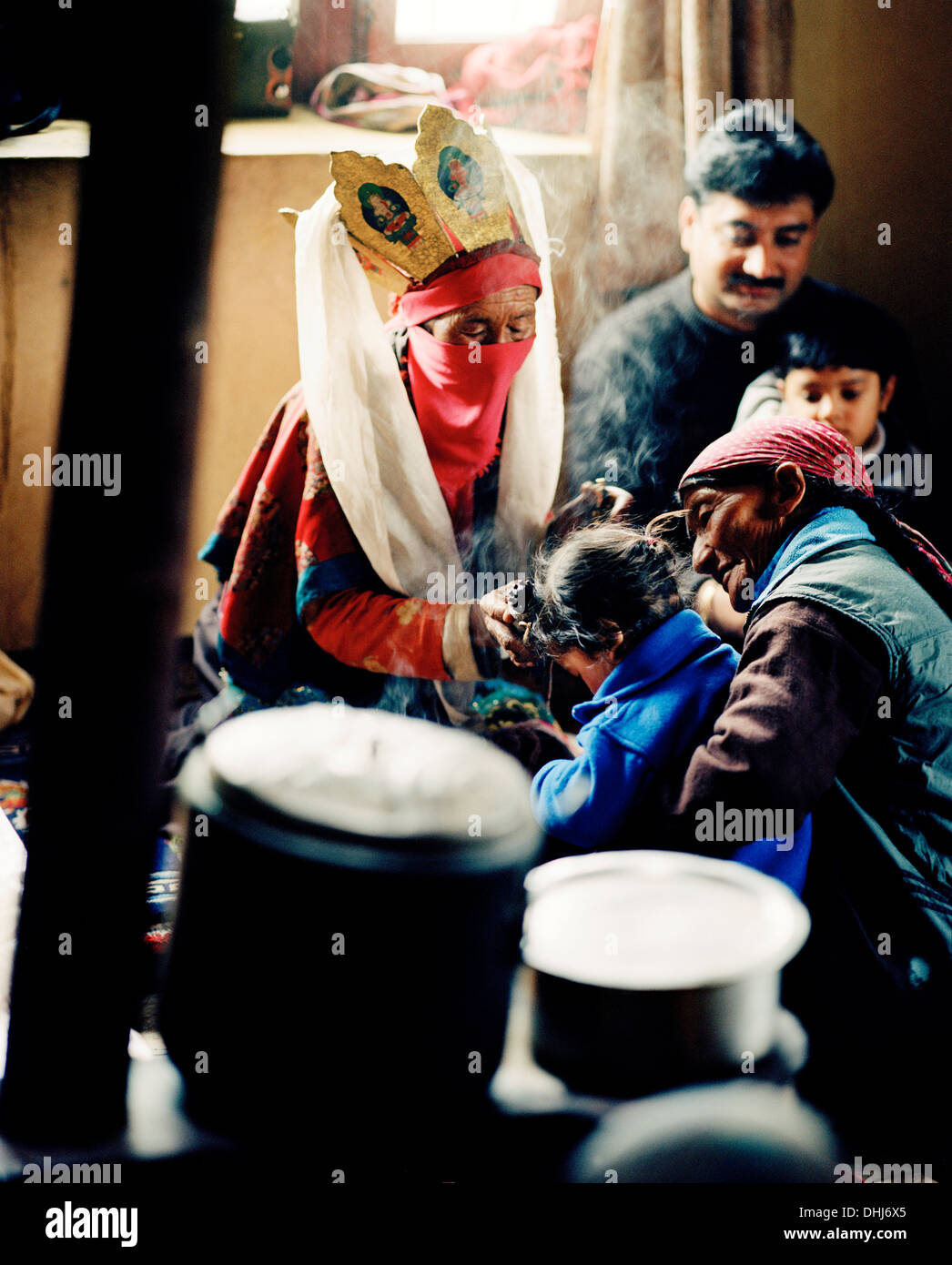 Oracle of Sabu, 77 year old healer Sonam Sangmu is treating a child in ...