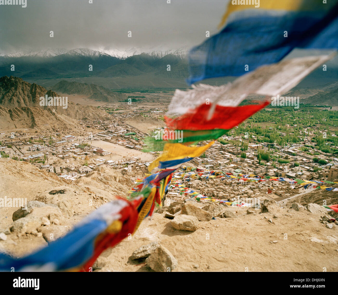 View through Buddhist prayer flags over capital Leh, Indus valley ...