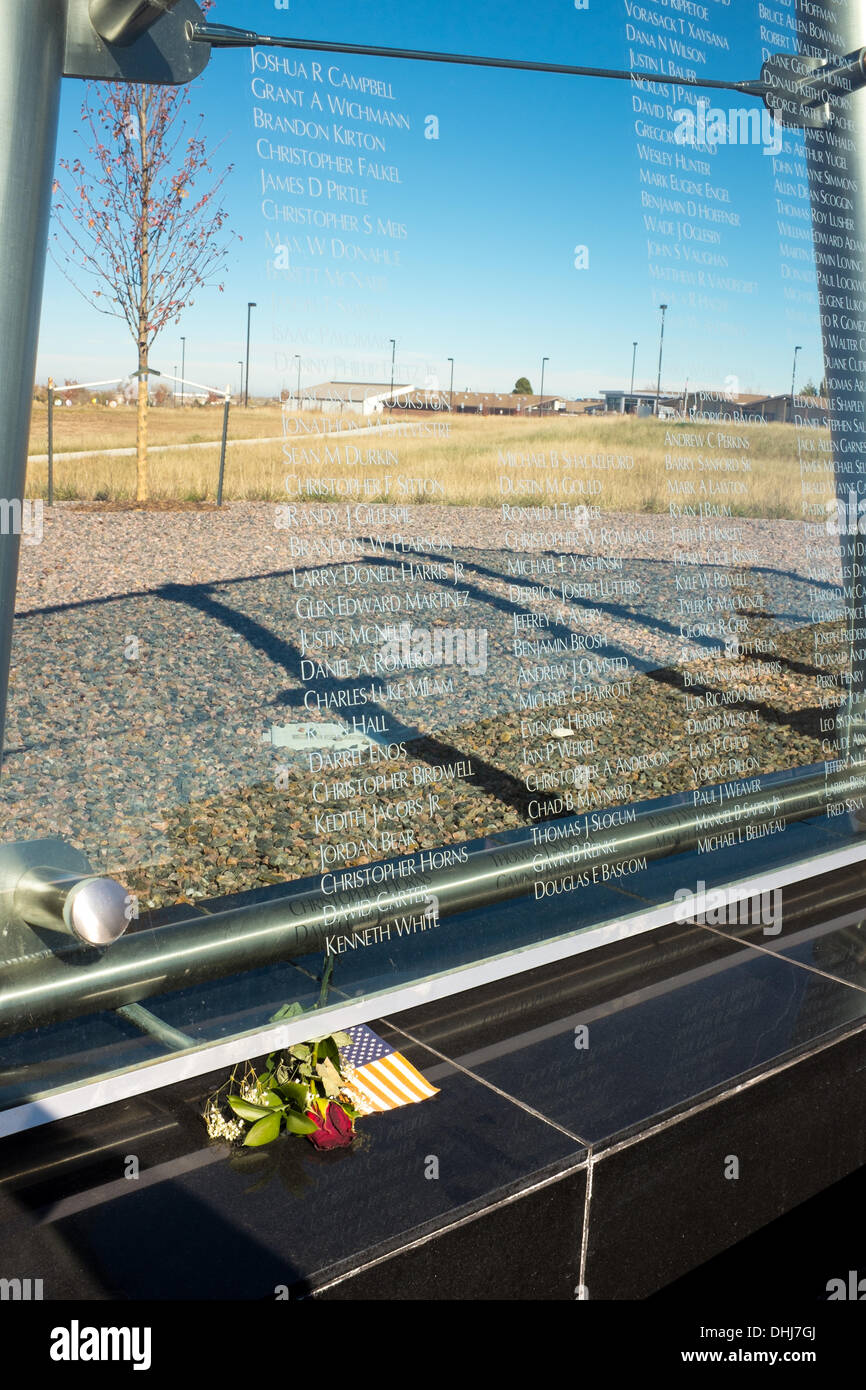 Aurora, Colorado USA 11, November 2013. A rose and a flag are left at ...