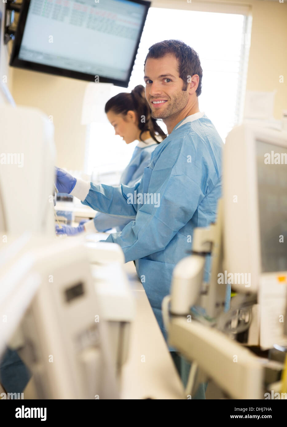 Researcher With Colleague Working In Laboratory Stock Photo - Alamy