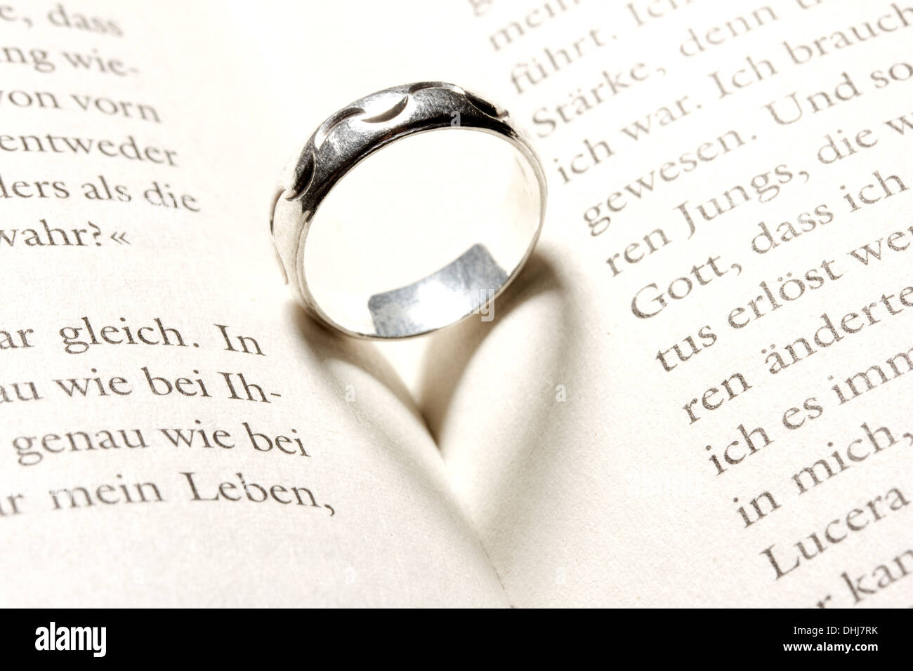 heart in a book by a ring Stock Photo - Alamy