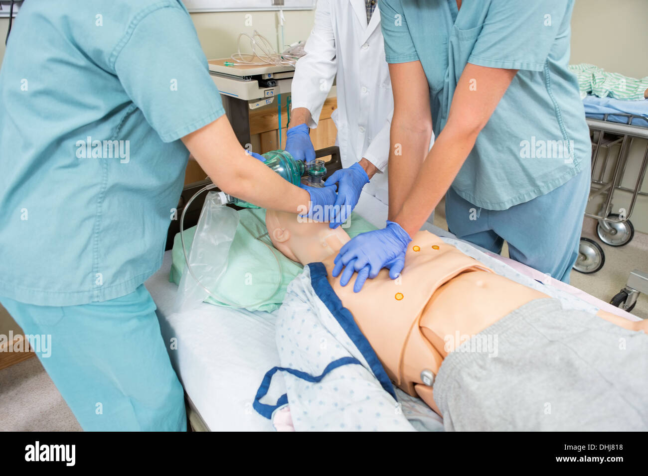 Nurses And Doctor Performing CPR On Dummy Stock Photo - Alamy