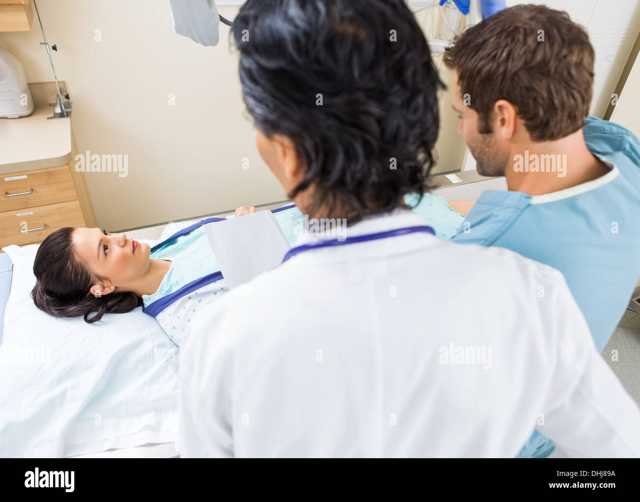 Nurse And Doctor Preparing Patient For Xray Stock Photo - Alamy