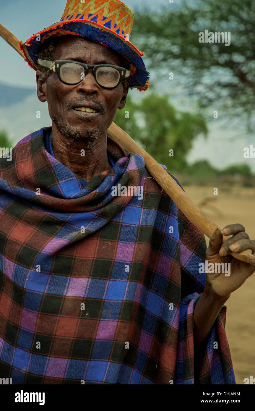 A member of the tribe poses to be taken a picture in Omo Valley ...