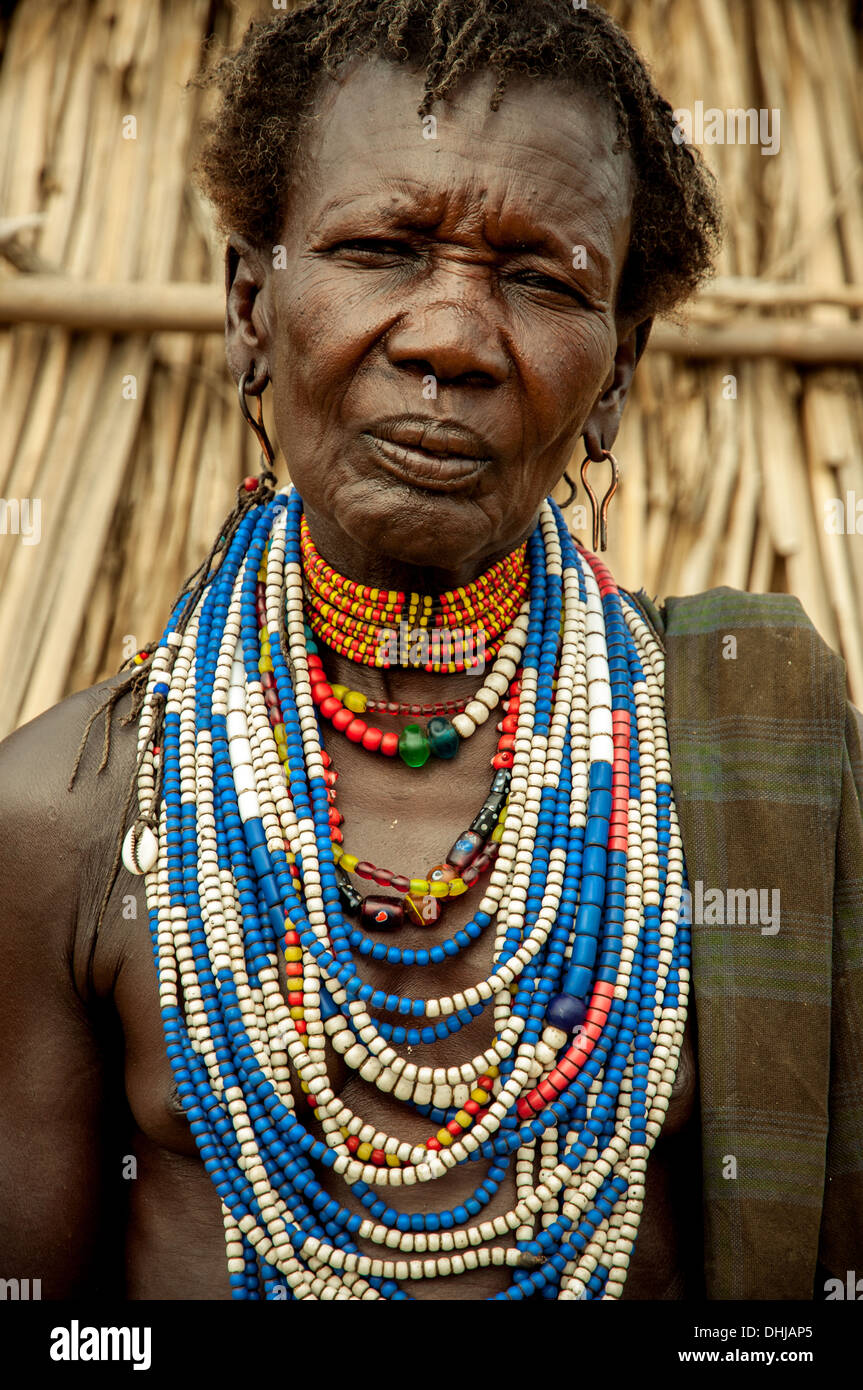 A member of the tribe poses to be taken a picture in Omo Valley ...