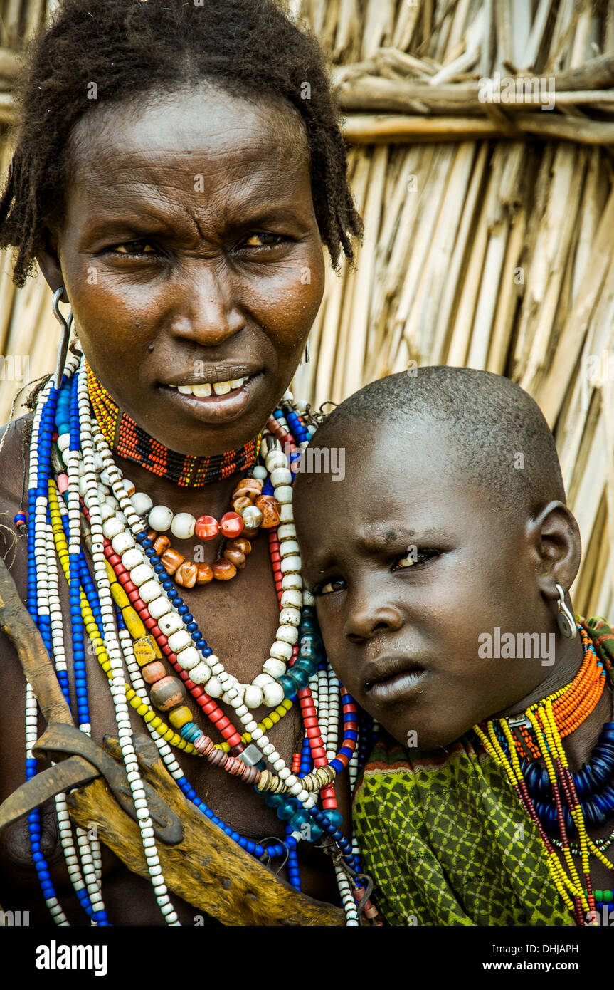 A member of the tribe poses to be taken a picture in Omo Valley ...