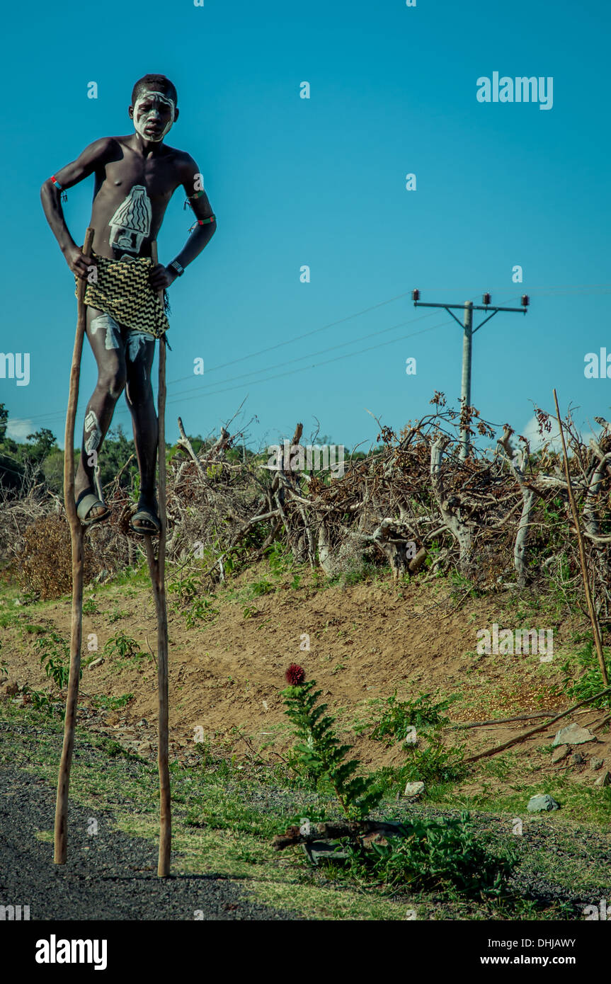 A member of the tribe poses to be taken a picture in Omo Valley ...