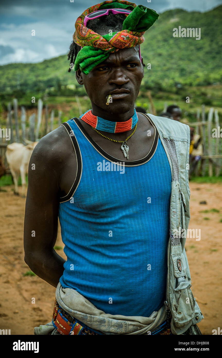 A member of the tribe poses to be taken a picture in Omo Valley ...