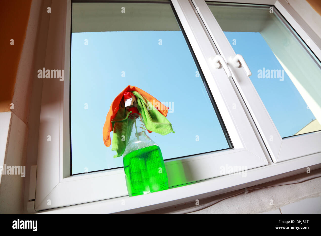 Cleaning window using tools - rag and spray detergent. Spring cleaning ...