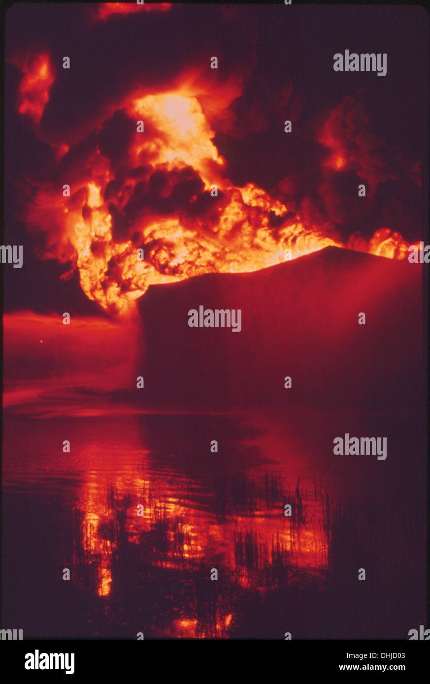 This image depicts a Texaco crude oil tank igniting after being struck ...