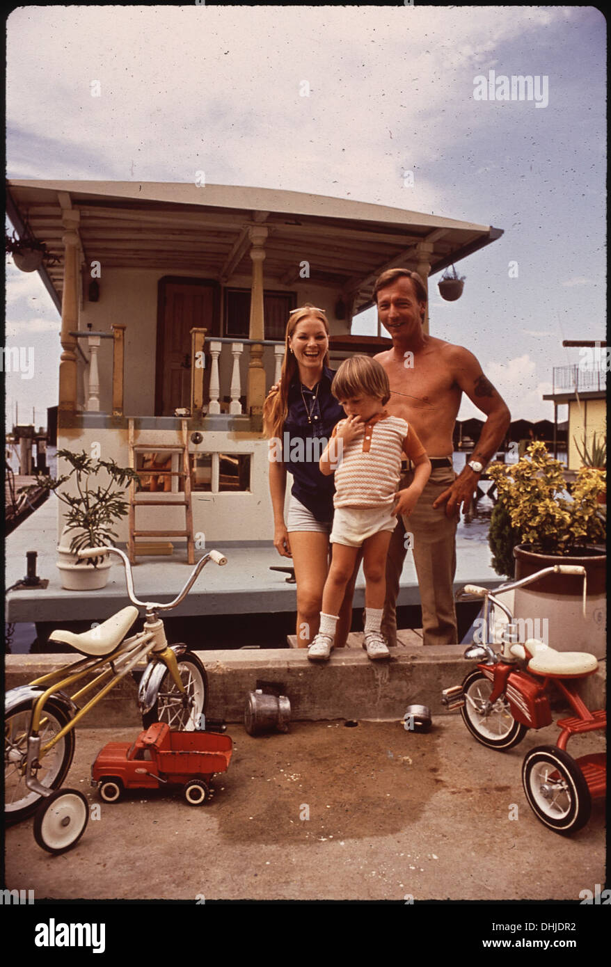 This image shows a family living on a houseboat, highlighting a ...