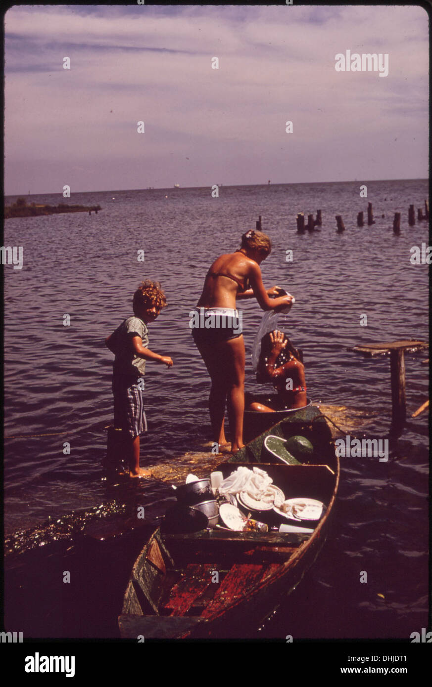 This image portrays a family of fishermen, capturing their daily life ...
