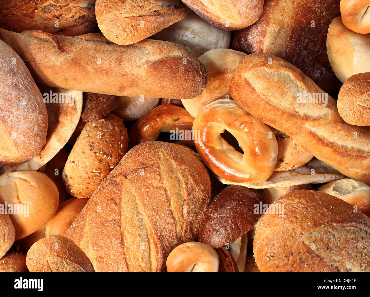 Bread background staple food concept with a group of baked goods from a ...