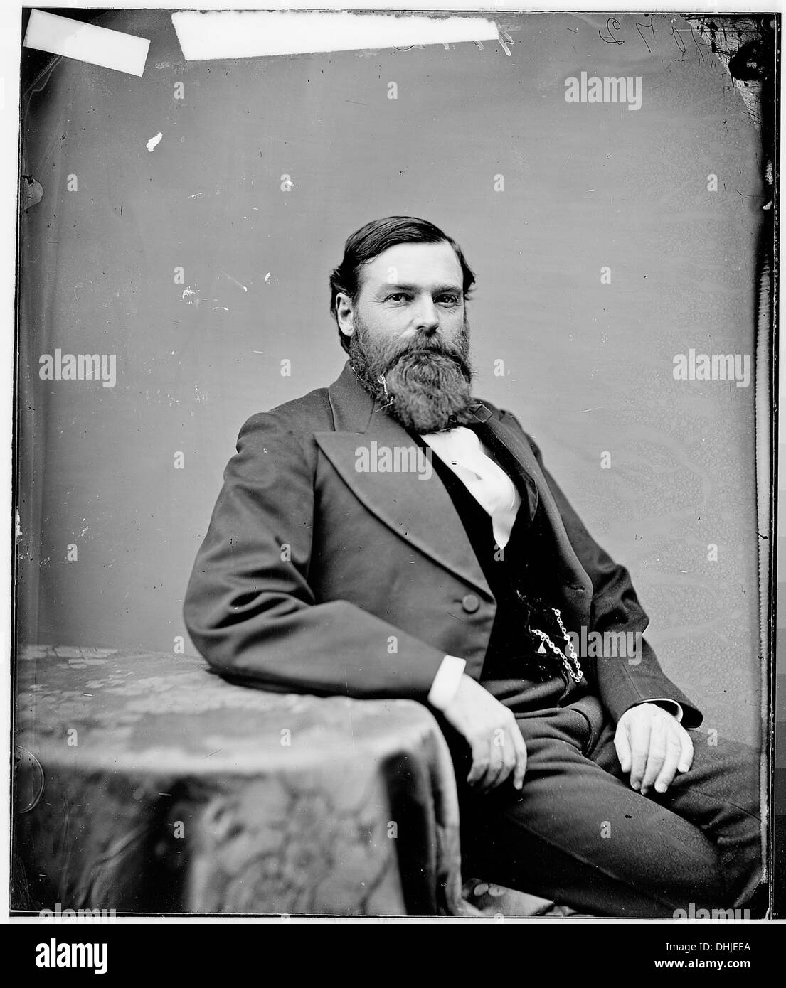 A formal portrait of a gentleman, captured in a neutral setting. The ...