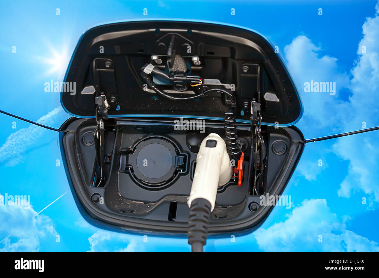 Electric hybrid car charging socket, plugged in Stock Photo - Alamy