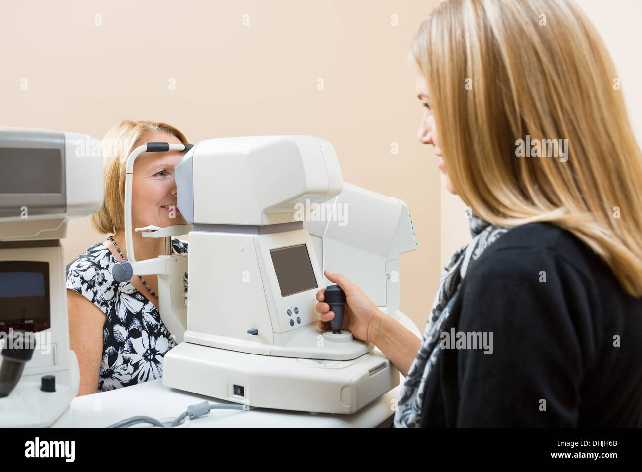 Optometrist Using Tonometer to Measure Patients Eye Pressure Stock ...