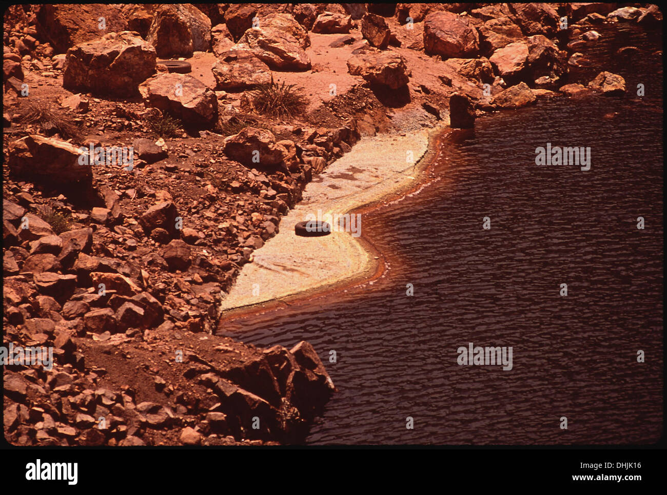 A photograph showing a waste-rock dump, part of a mining operation ...