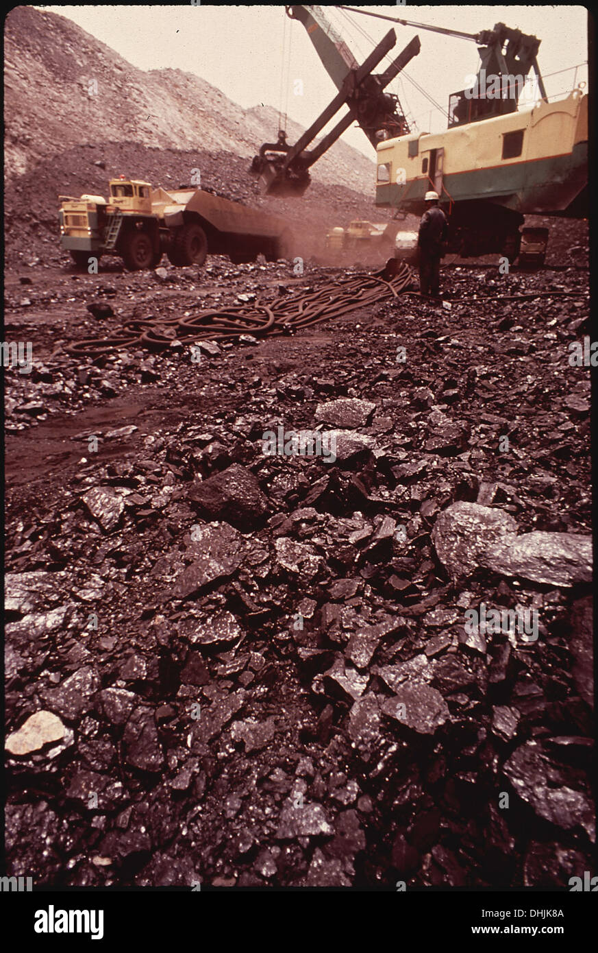 This image shows workers using an electric shovel to extract minerals ...