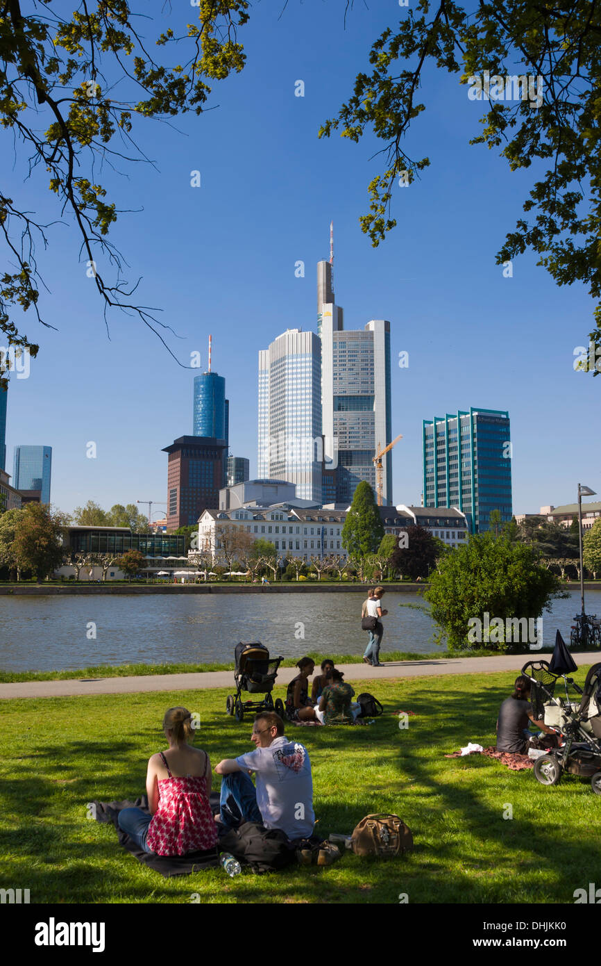 Germany, Hesse, Frankfurt, People at River Main with skyline in ...