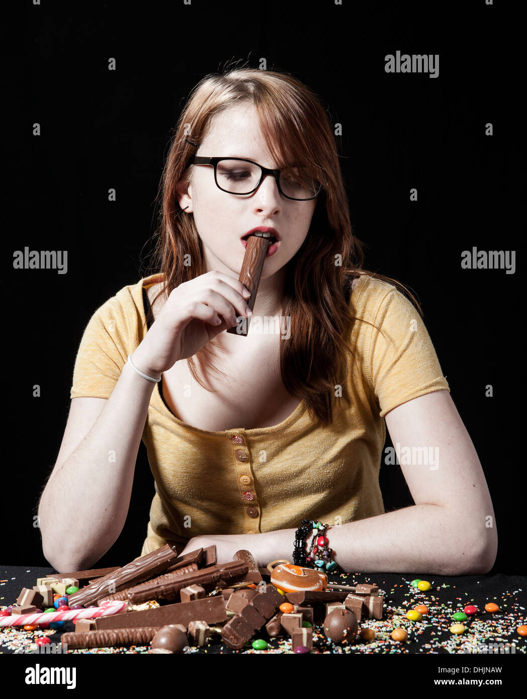 Black woman eating chocolate bar hi-res stock photography and images ...