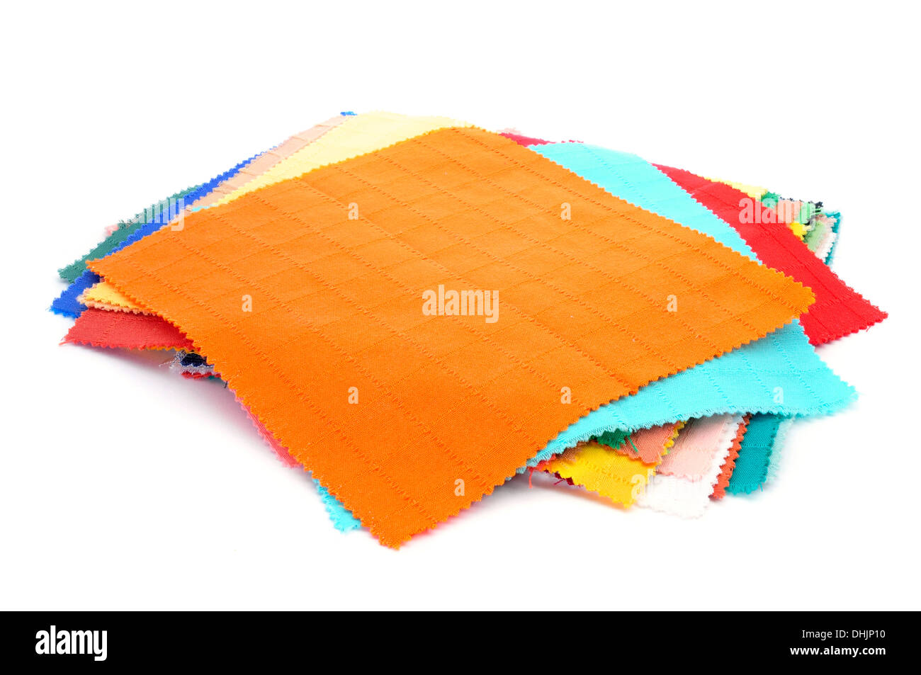 square pieces of fabric with different colors and patterns on a white ...