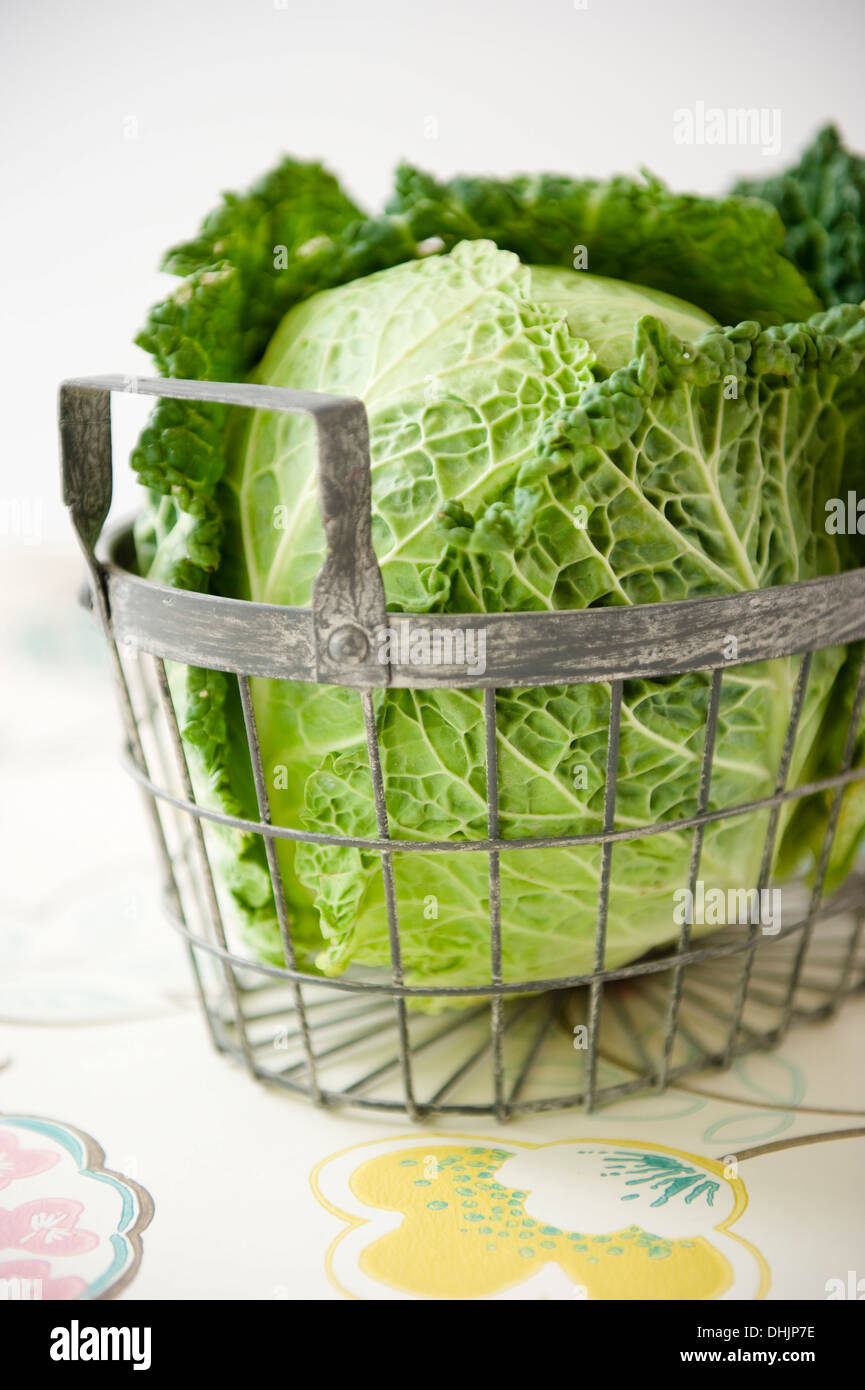 Green cabbage in a basket, Homegrown Stock Photo - Alamy