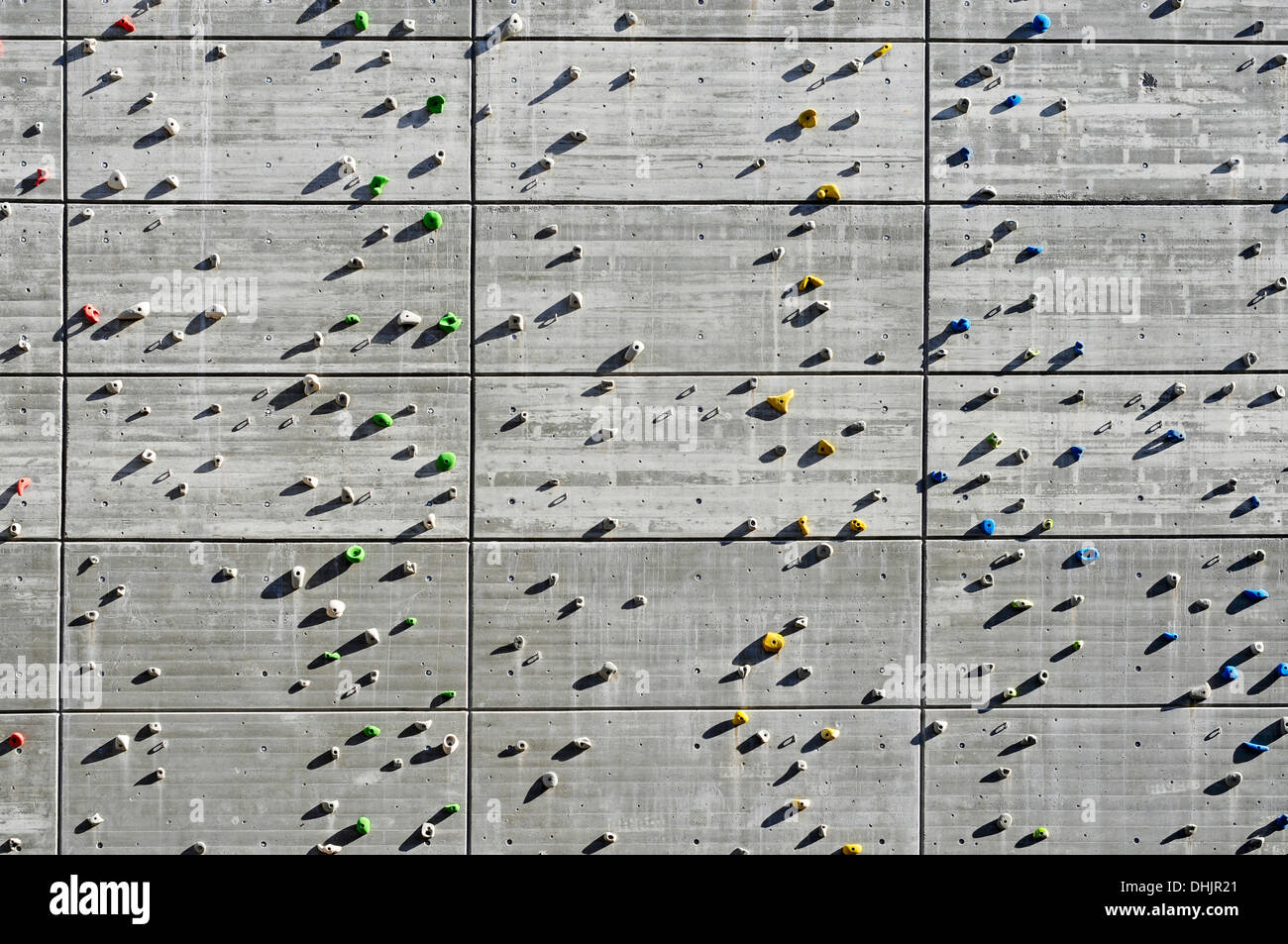 detail of a concrete climbing wall with grips for hands and feet Stock ...