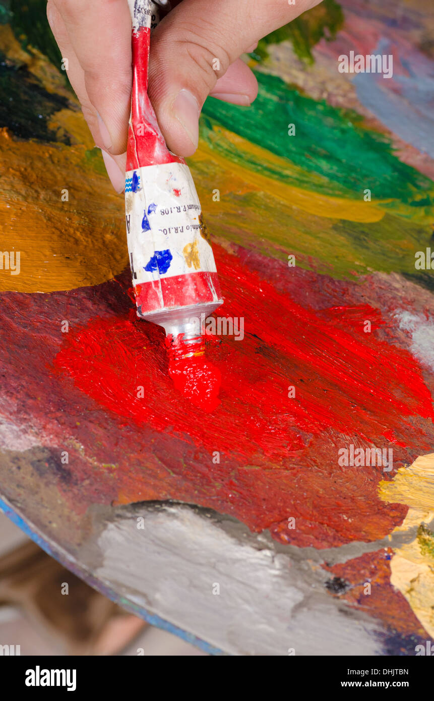 Squeezing red paint onto palette hi-res stock photography and images ...