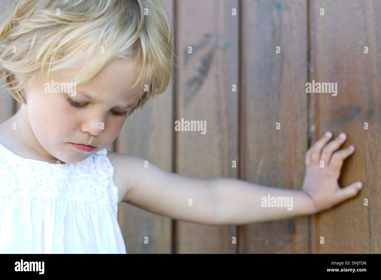 Denmark, Ringkoebing, sad little girl Stock Photo - Alamy