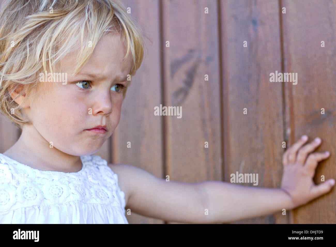 Denmark, Ringkoebing, sad little girl Stock Photo - Alamy