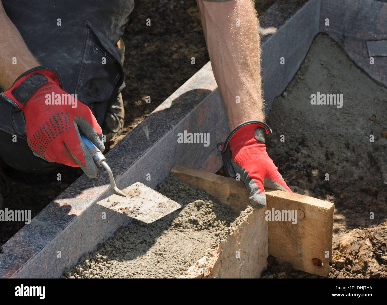 Stonemason working on a grave Stock Photo - Alamy