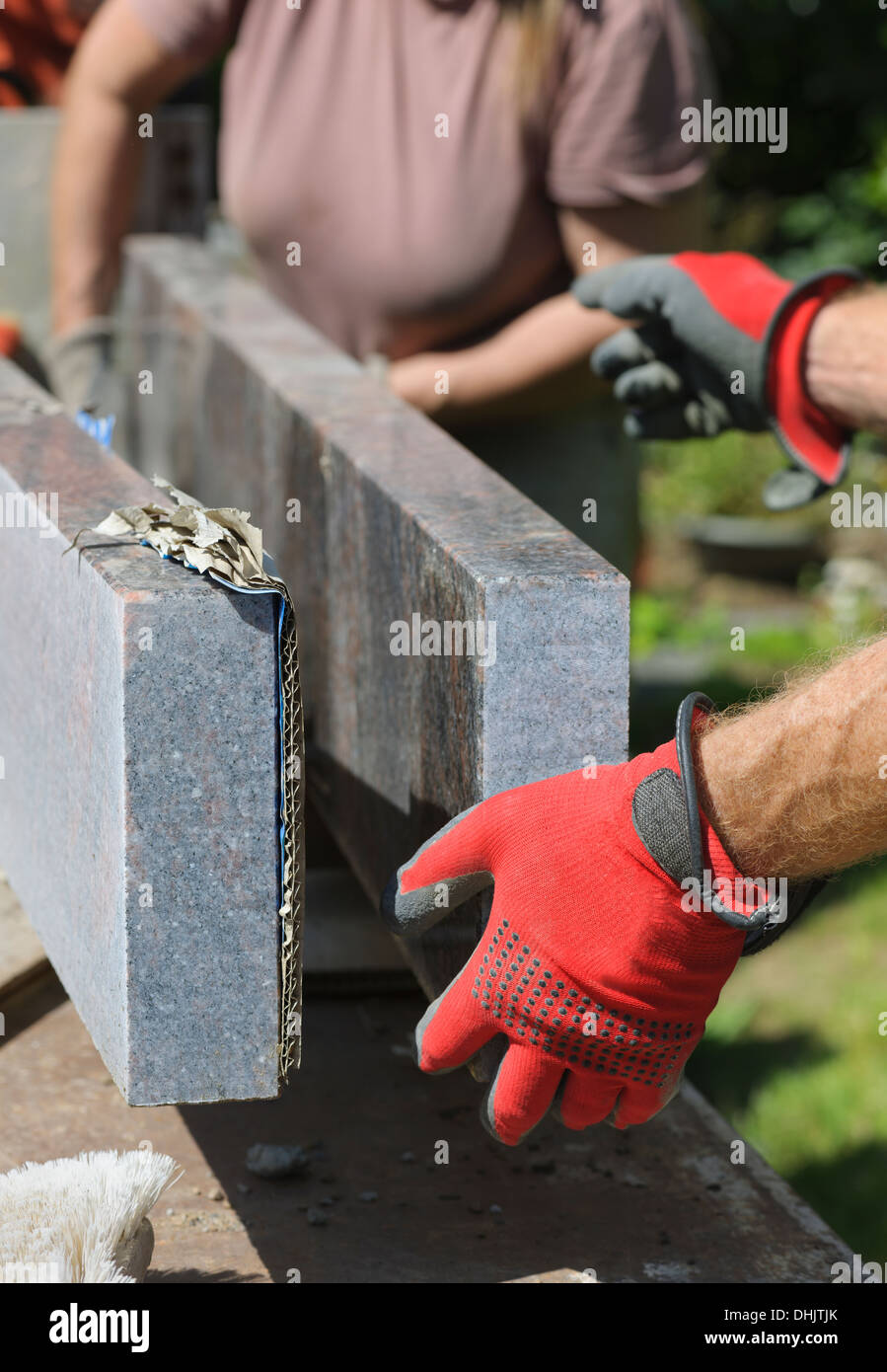 Two stonemasons working on a grave, carrying gravestone Stock Photo - Alamy